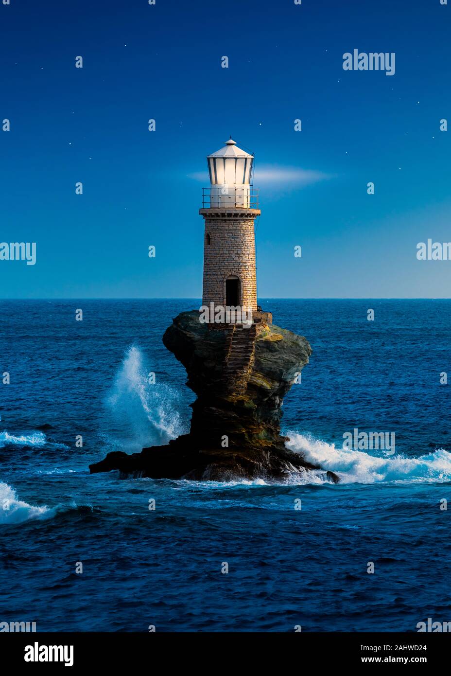 The beautiful Lighthouse Tourlitis of Chora at night. Andros island ...