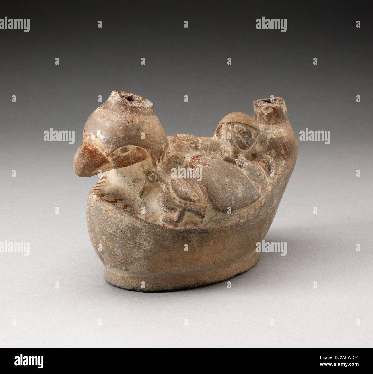 Moche. Stirrup Spout Vessel in Form of a Man Laying on a Bird. 100 BC ...