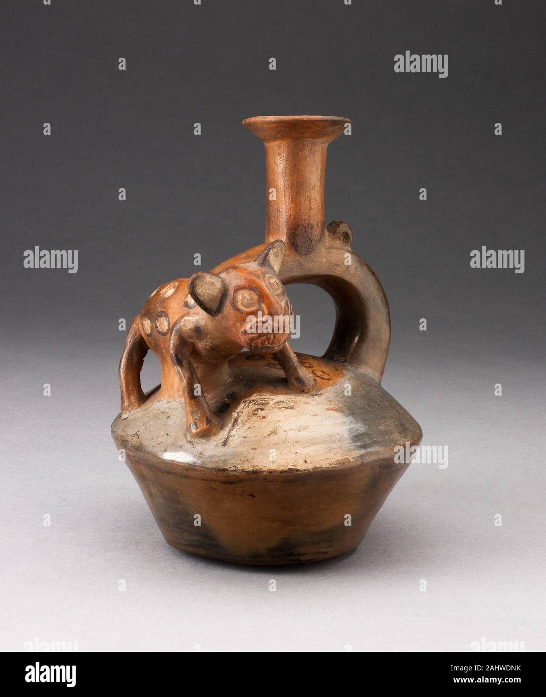Chimú-Inca. Stirrup Spout Vessel with Spotted Feline Standing on Top ...