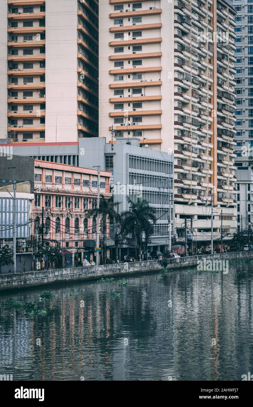 Buildings along the Pasig River, in Binondo, Manila, The Philippines ...