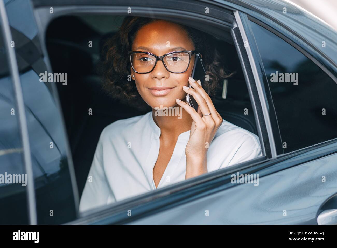 Eyeglasses back woman sitting talking hi-res stock photography and ...