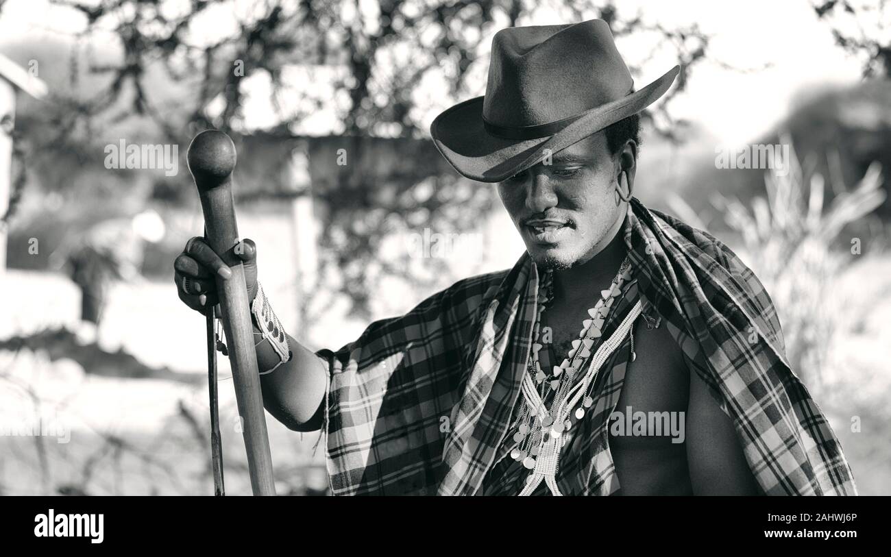 handsome maasai warrior in a cowboy hat Stock Photo - Alamy