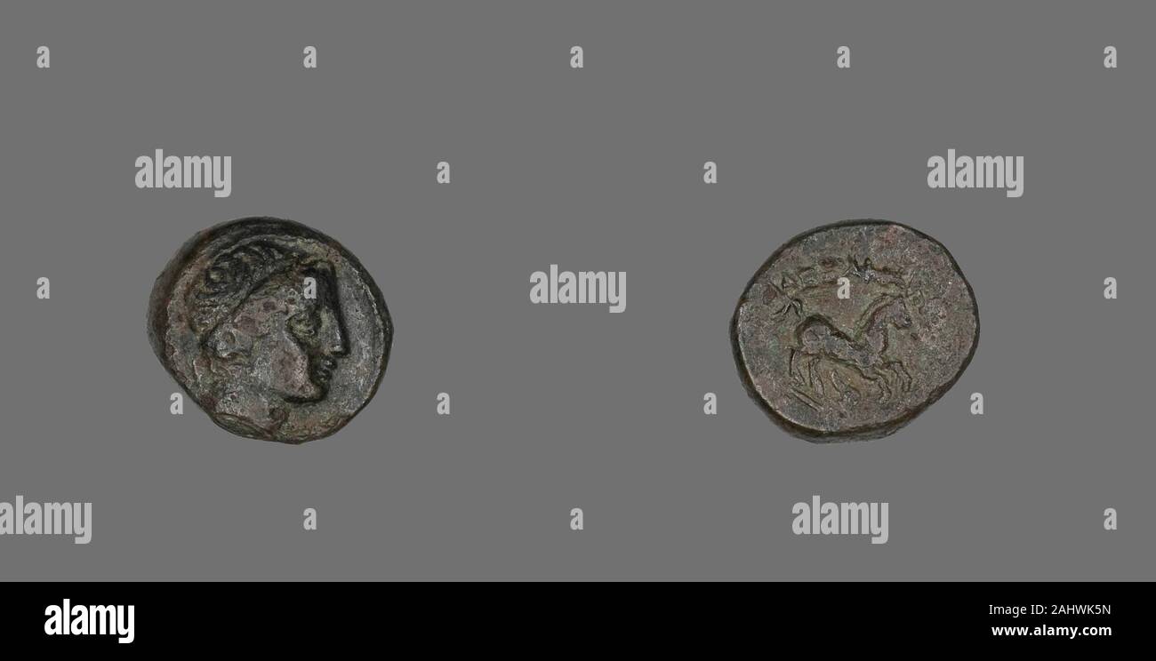 Ancient Greek. Coin Depicting the God Apollo ( ). 336 BC–323 BC. Greece ...