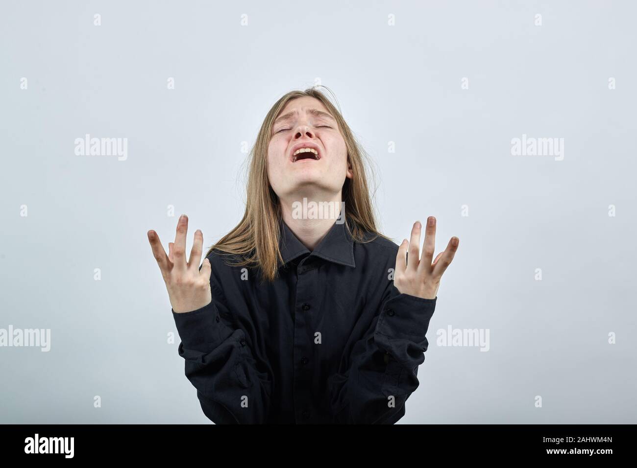 Disappointed young woman spreads hands, crying. People sincere emotions ...