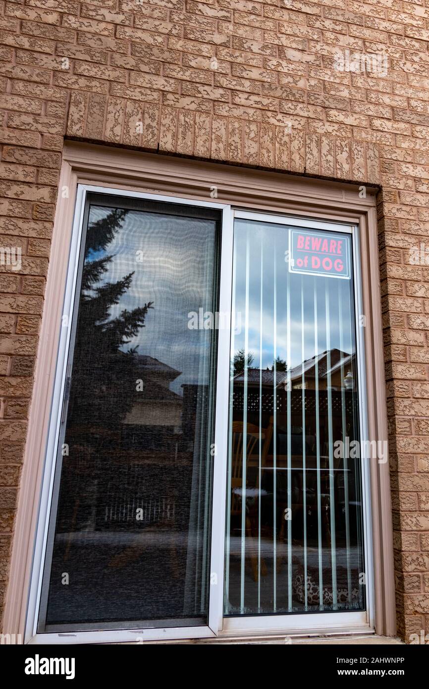 Beware of Dog sign in window Stock Photo - Alamy