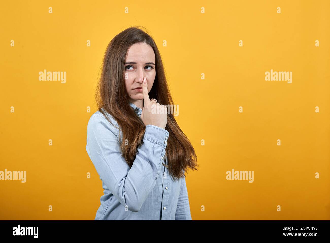 Woman finger pointing nose hi-res stock photography and images - Alamy