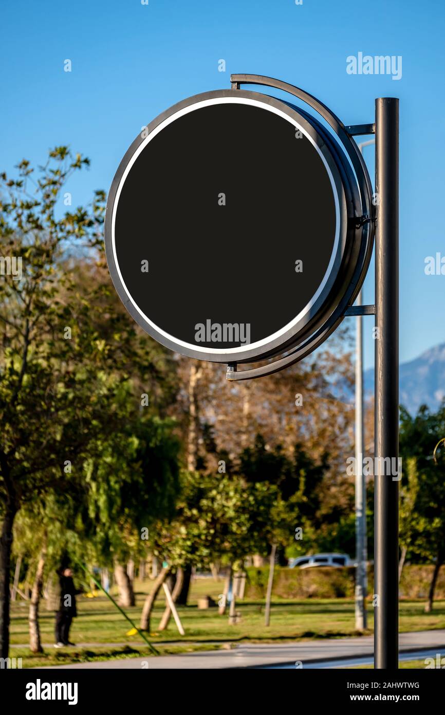 round black signboard on the street in the city Stock Photo - Alamy