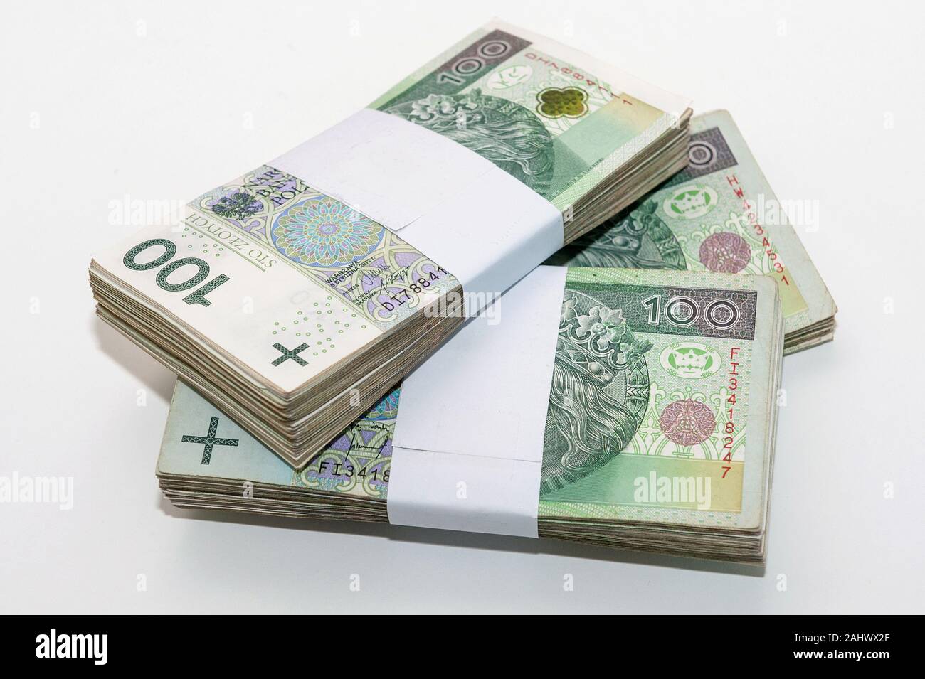 Polish money pile. One hundred polish zloty (PLN) banknotes on white ...