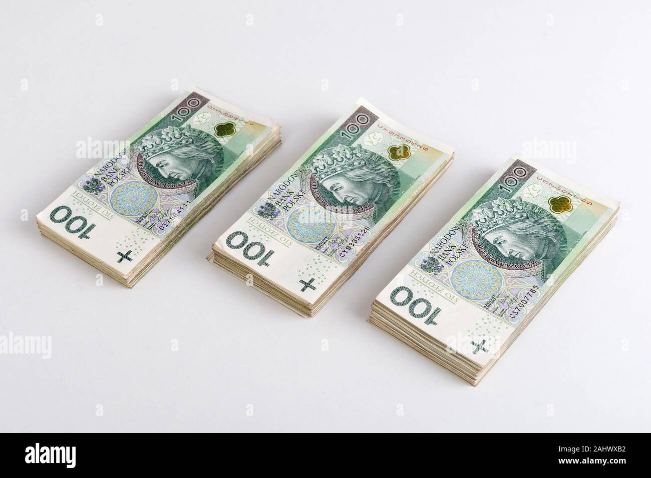 Polish money pile. One hundred polish zloty (PLN) banknotes on white ...