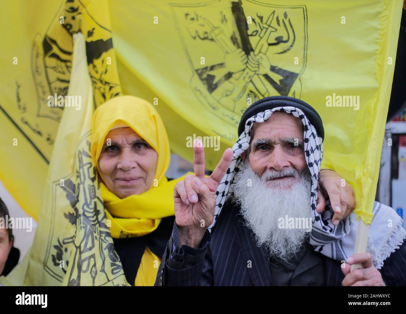 Palestinian Fatah supporters pose for the camera during a rally marking ...