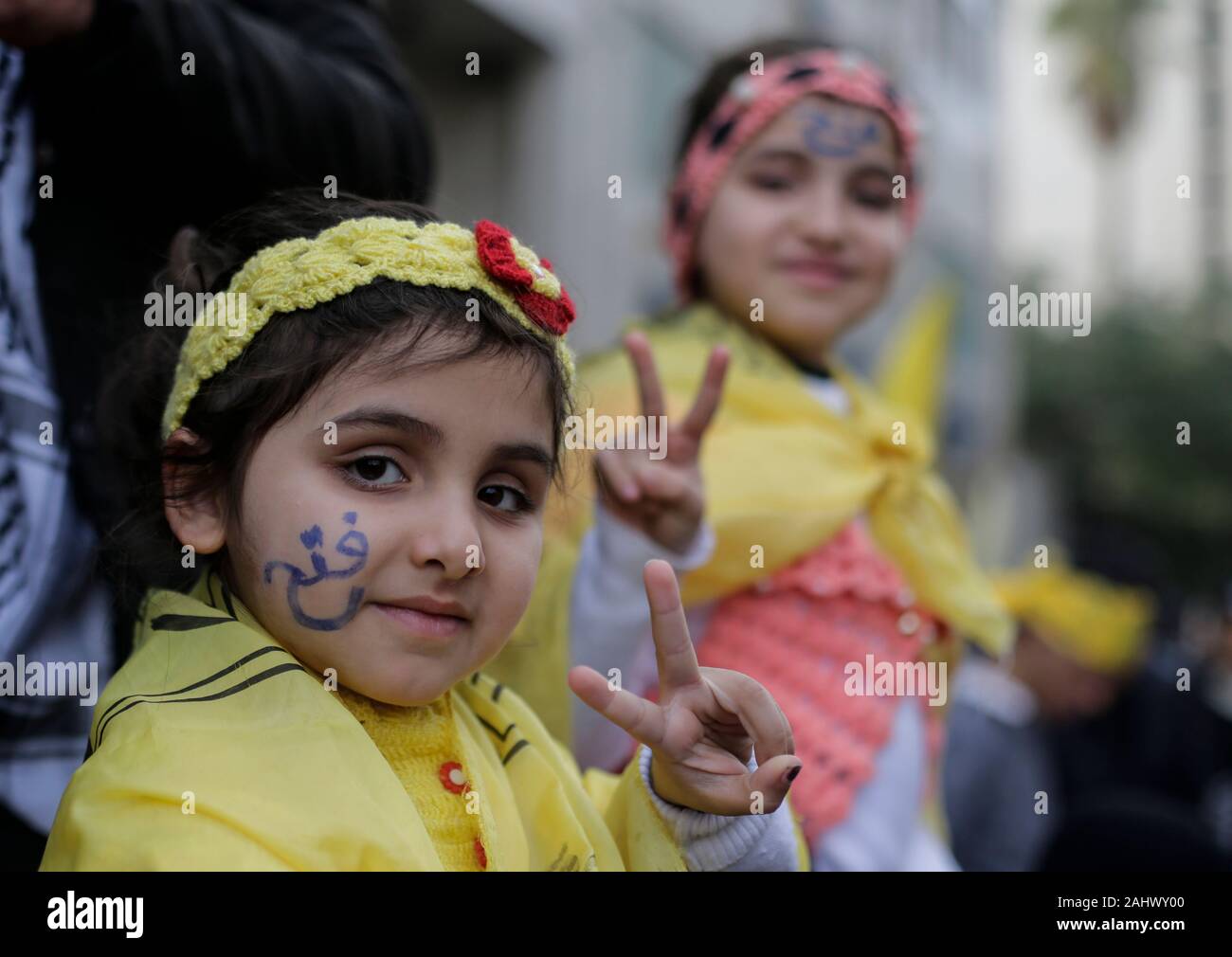 Palestinian kids gesture during a rally marking the 55th anniversary of ...