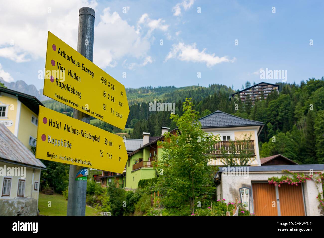 Yellow hiking table showing the way for hiking Austria alps Stock Photo ...