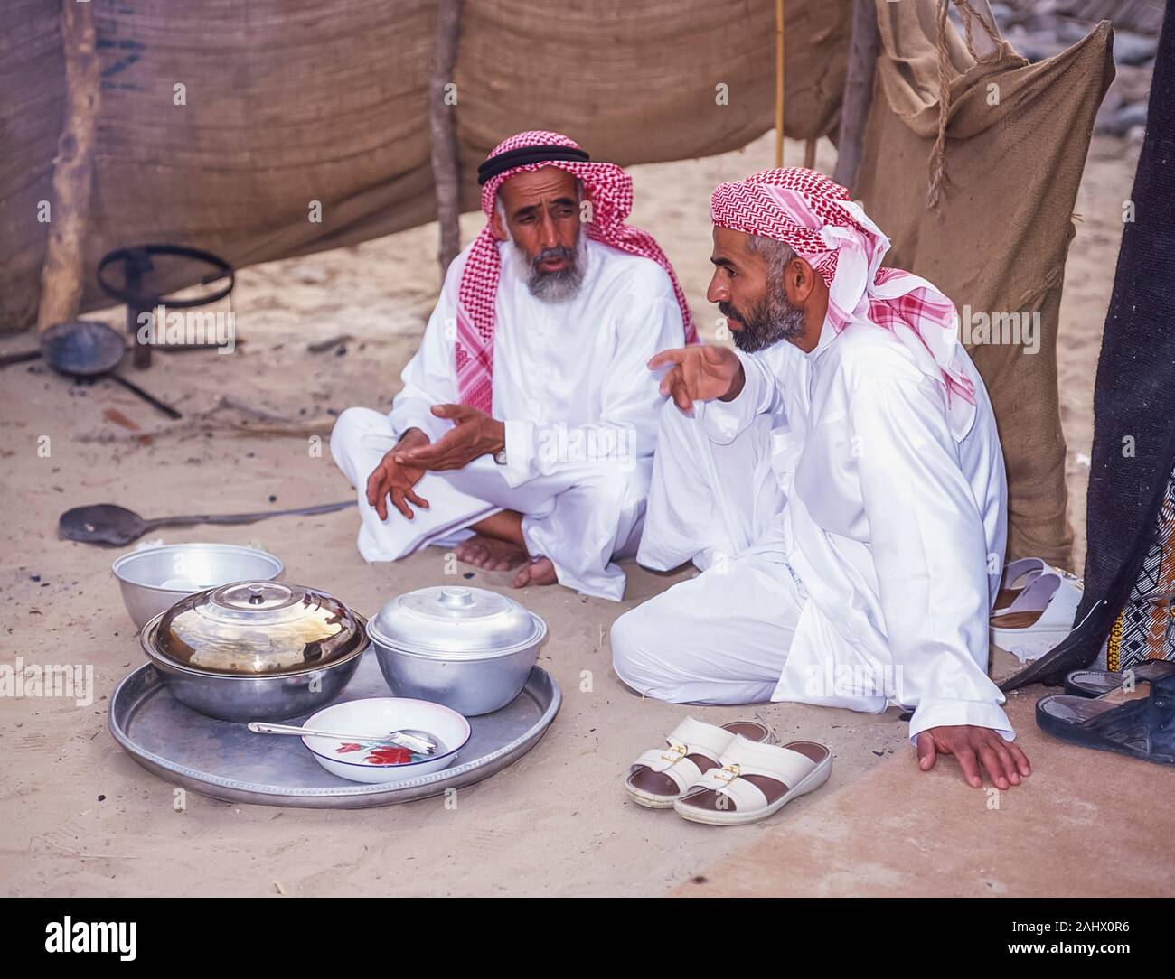 Dubai Arab folklore and history with a couple of Emirati men taking a ...