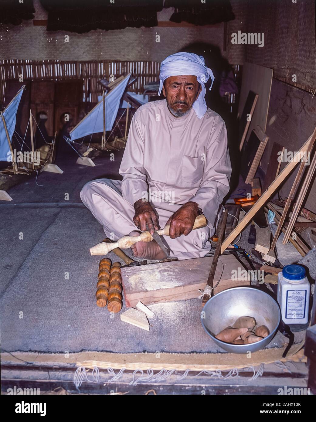 Dubai Arab folklore and history with an Emirati man demonstrating wood ...