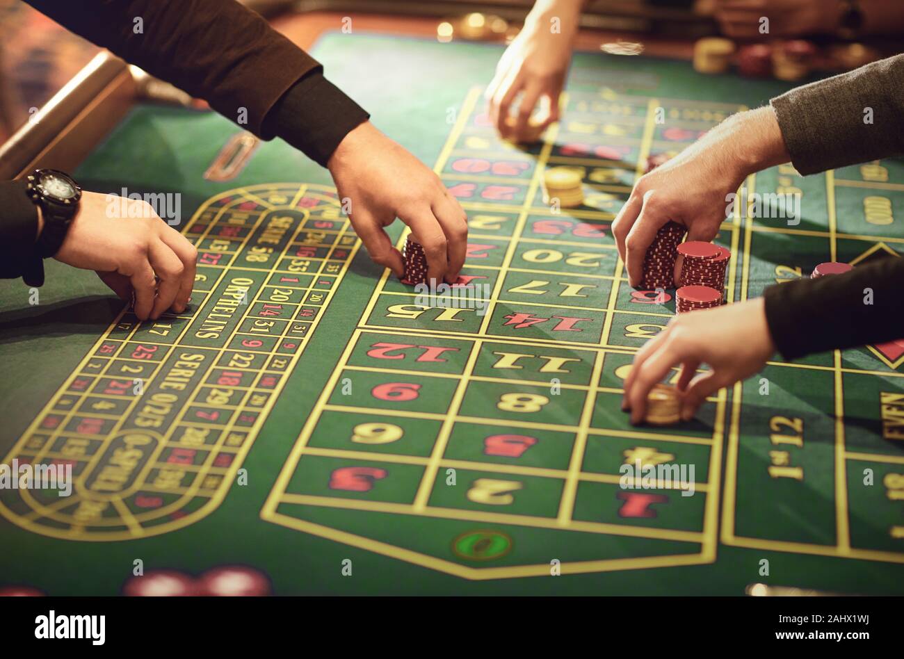 Man betting chips on casino hi-res stock photography and images - Alamy