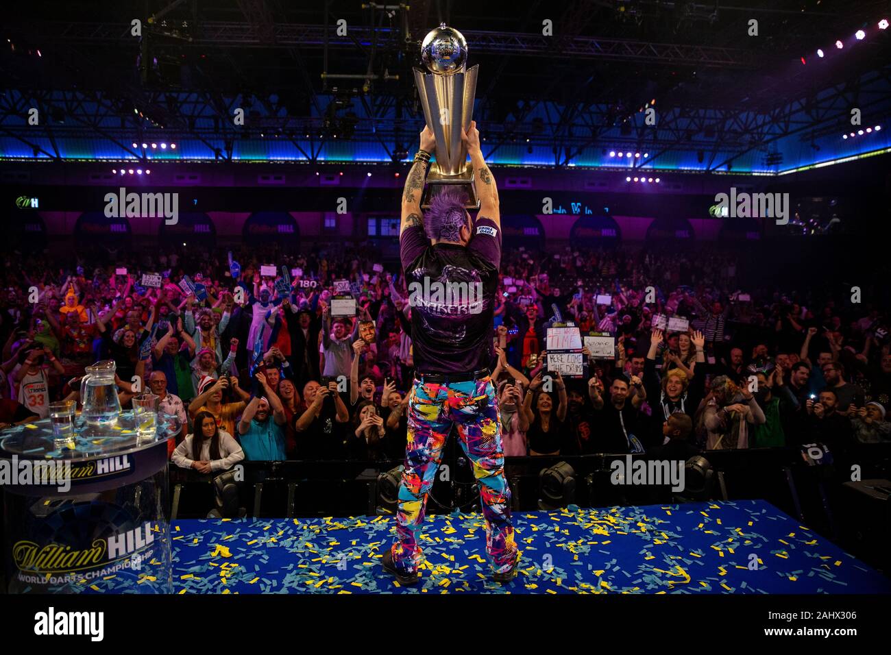 Peter Wright celebrates with the Sid Waddell trophy during day sixteen ...