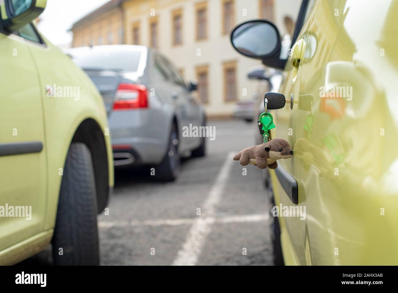 forgotten keys in lock of car standing on parking lot Stock Photo - Alamy