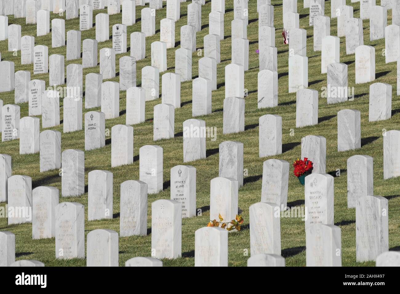 Gravestones line the green hills of the historic Santa Fe National ...