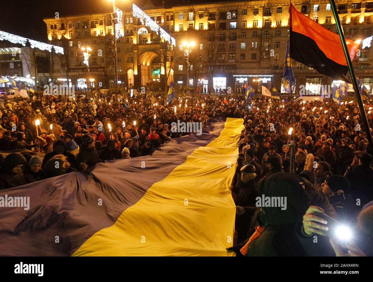Ukrainian far-right activists with a huge flag during the march ...