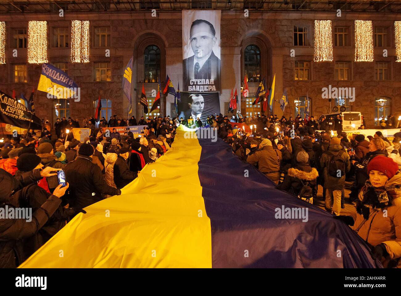 Ukrainian far-right activists with a huge flag during the march ...