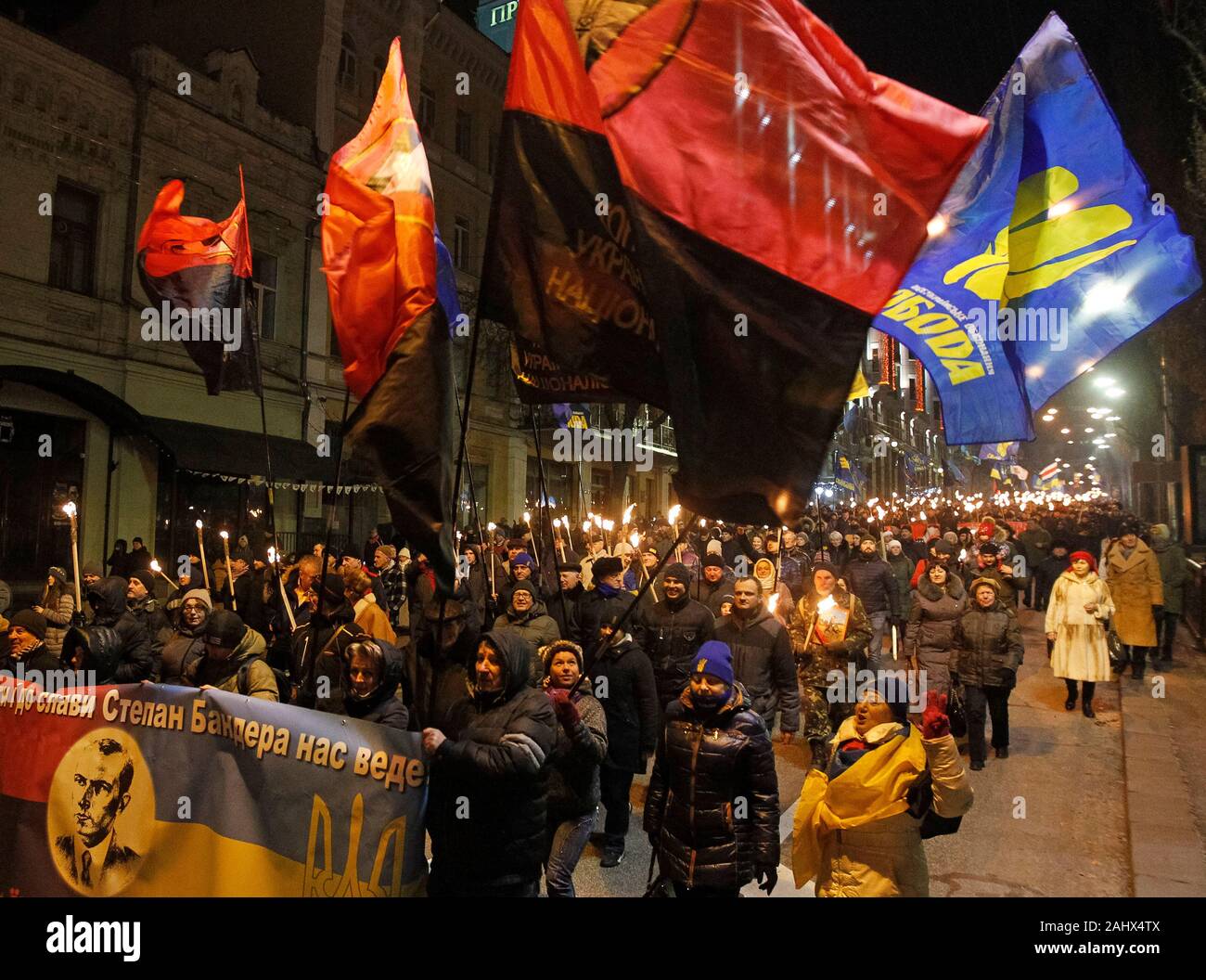 Ukrainian far-right activists with flags and banners during the march ...