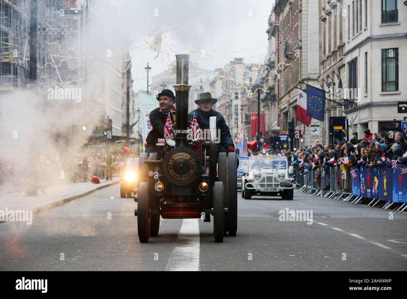 Miniature steam engines are driven during the annual London New Year's ...