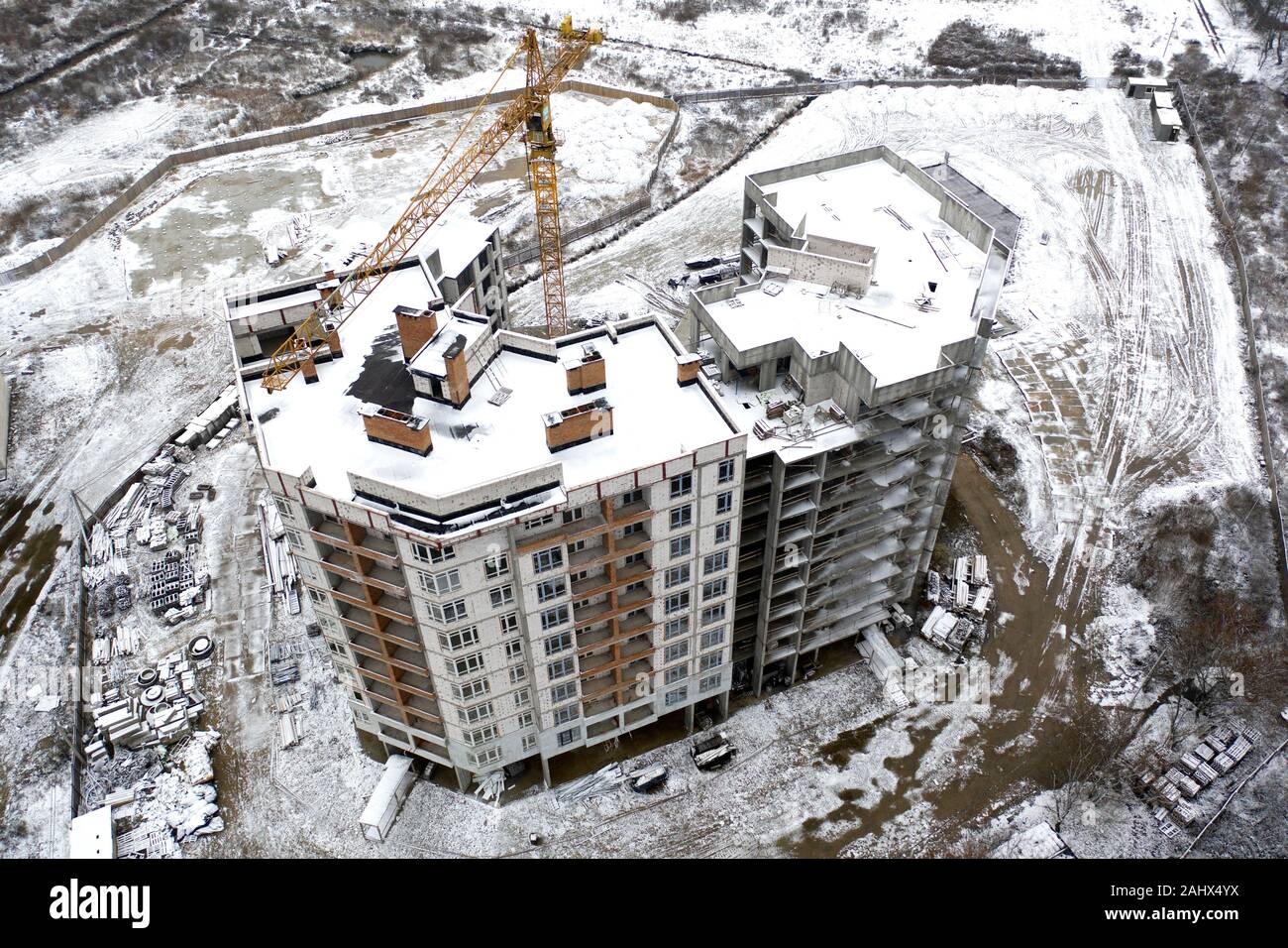 Snowy construction site and crane. Drone view Stock Photo - Alamy