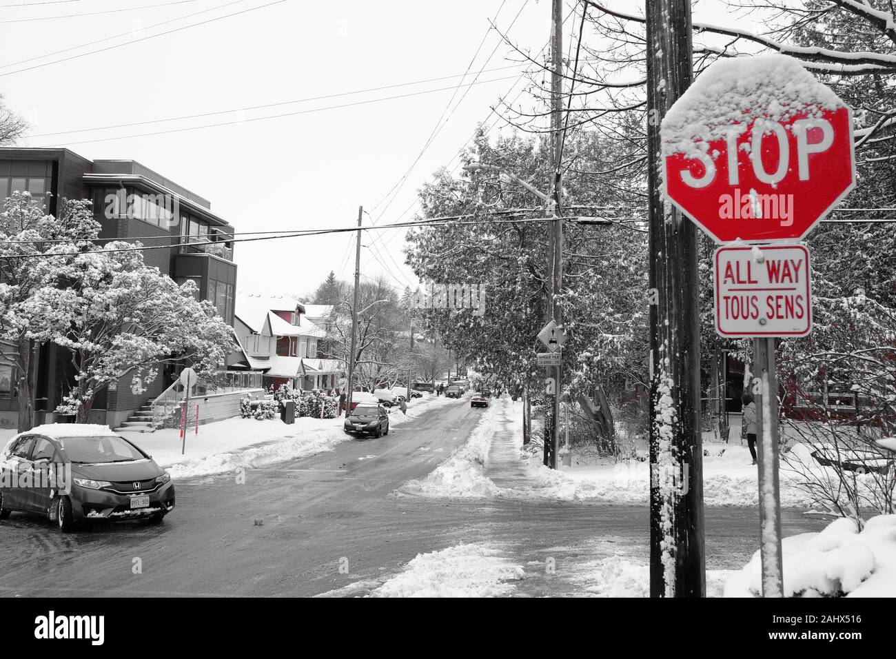 Car maneuvering a very snowy intersection in the Glebe, Ottawa, Ontario ...