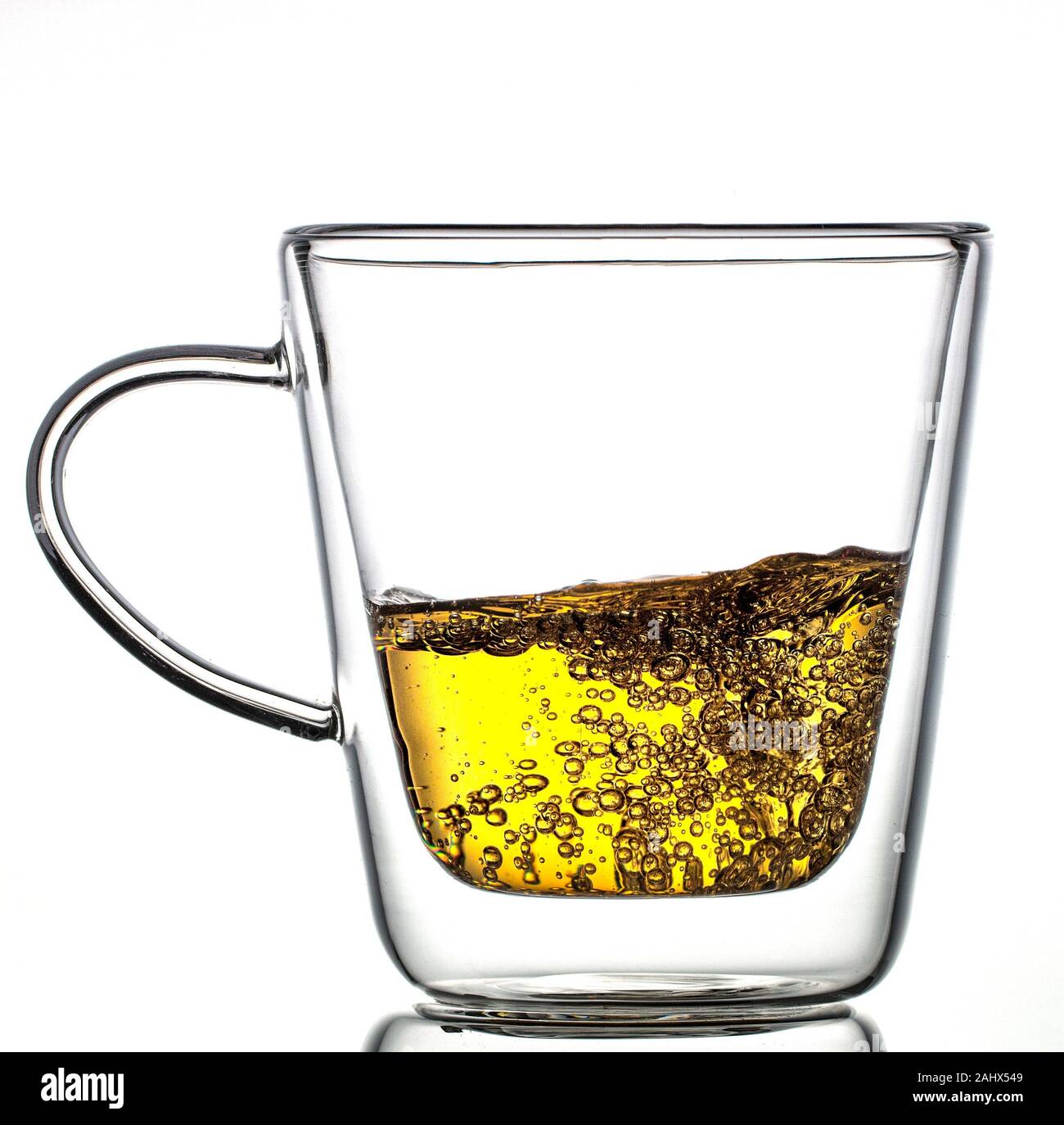 Glass transparent thermos cup with tea on a white background Stock ...