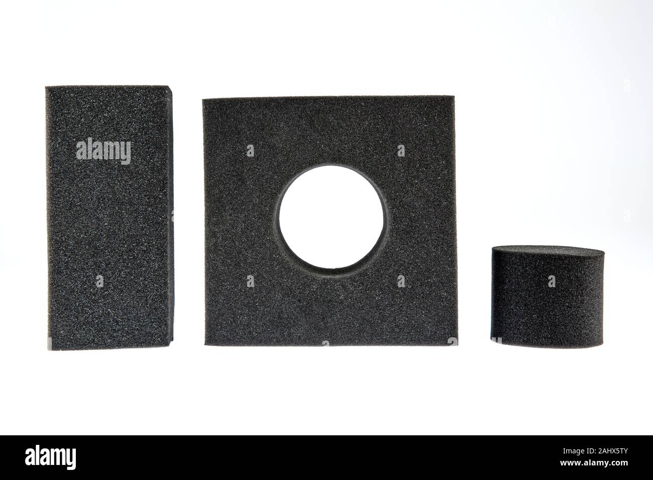 Technical Round Sponge. Black sponge foam in a shape of electronic or ...