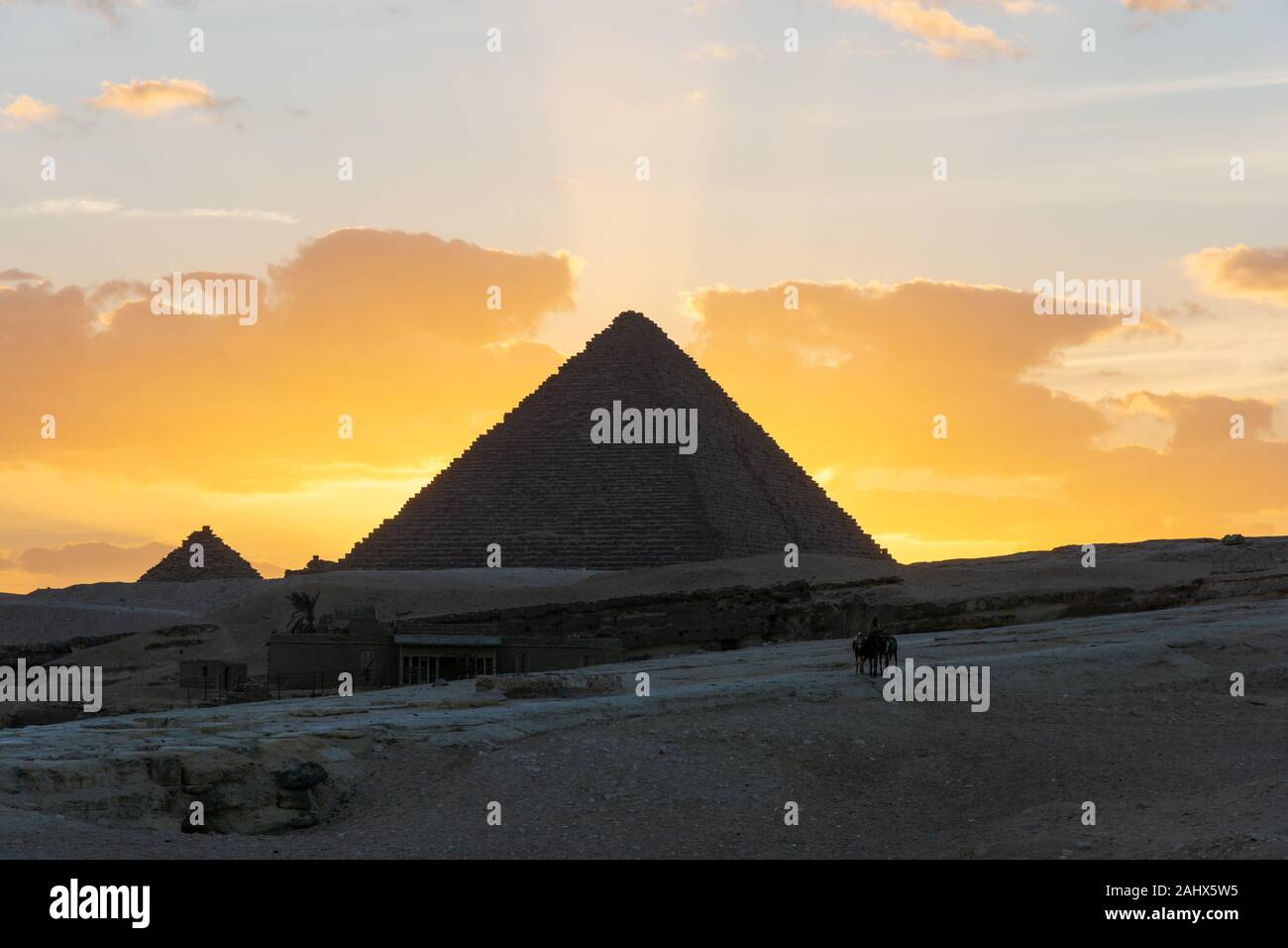 Sunset in Giza pyramid complex. The Sun is going down behind the ...