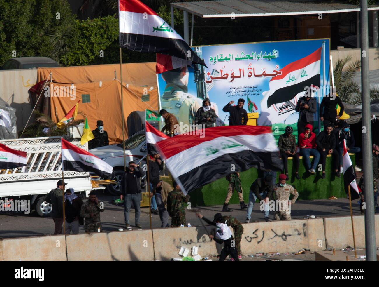 Baghdad, Iraq. 01st Jan, 2020. A group of civilians gathers outside the ...