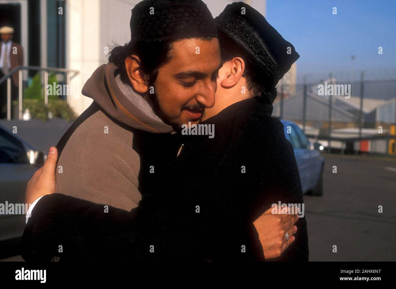 Muslim men embrace and wish each other eid mubarak outside the ...