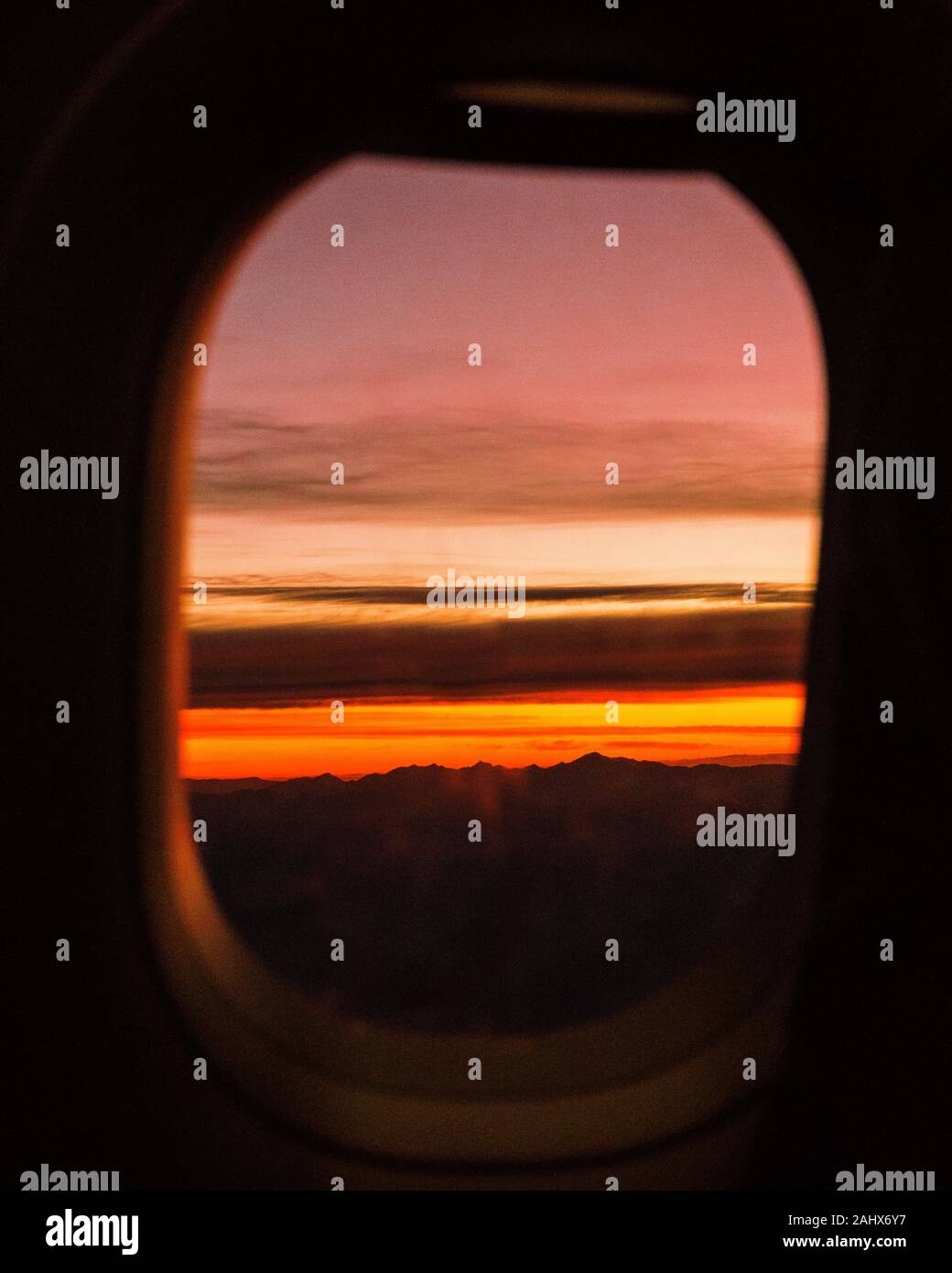 sunset in airplane window in flight Stock Photo - Alamy