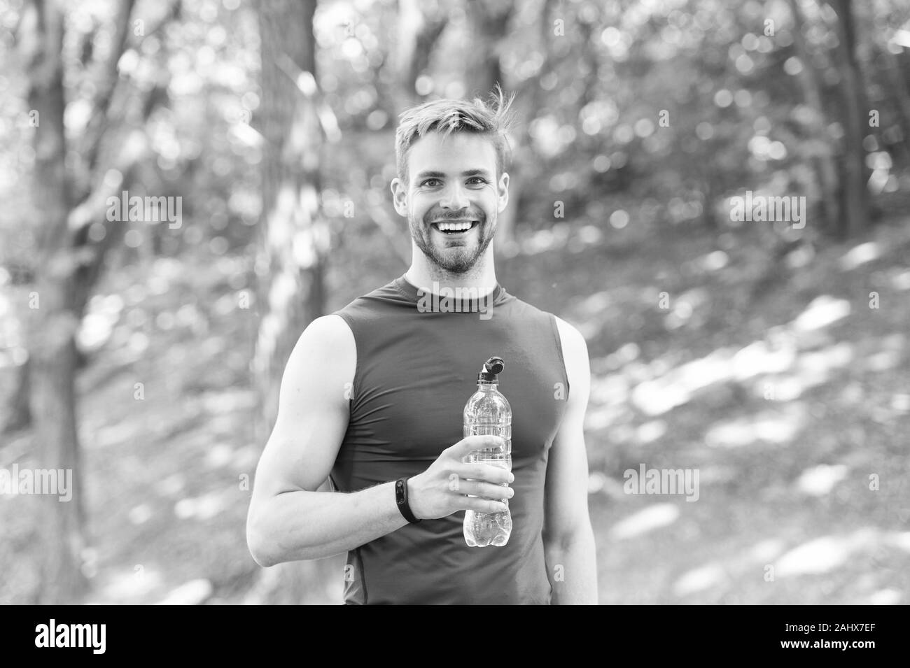 Healthy lifestyle. Refreshing drink. Man athletic sportsman hold bottle ...