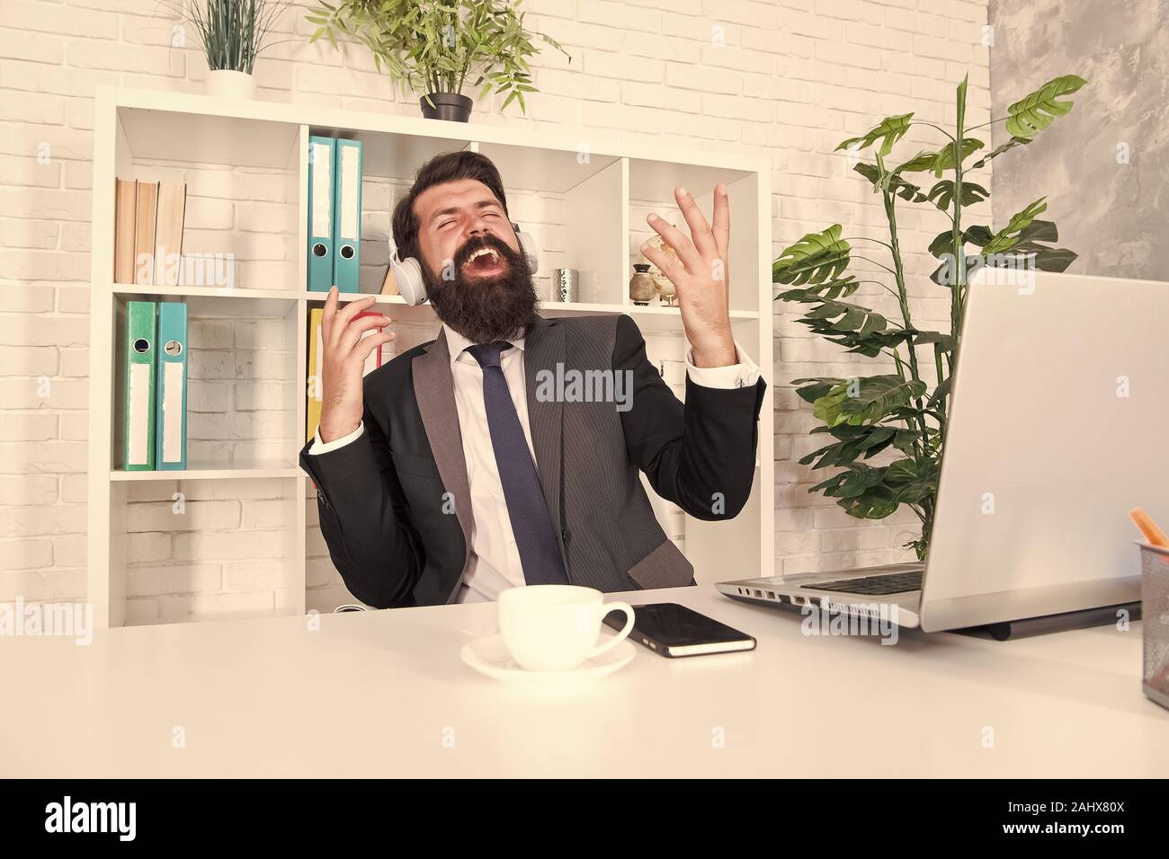 Accountant insurance agent relaxing with favorite music. Productivity ... Accountant insurance agent relaxing with favorite music. Productivity ...