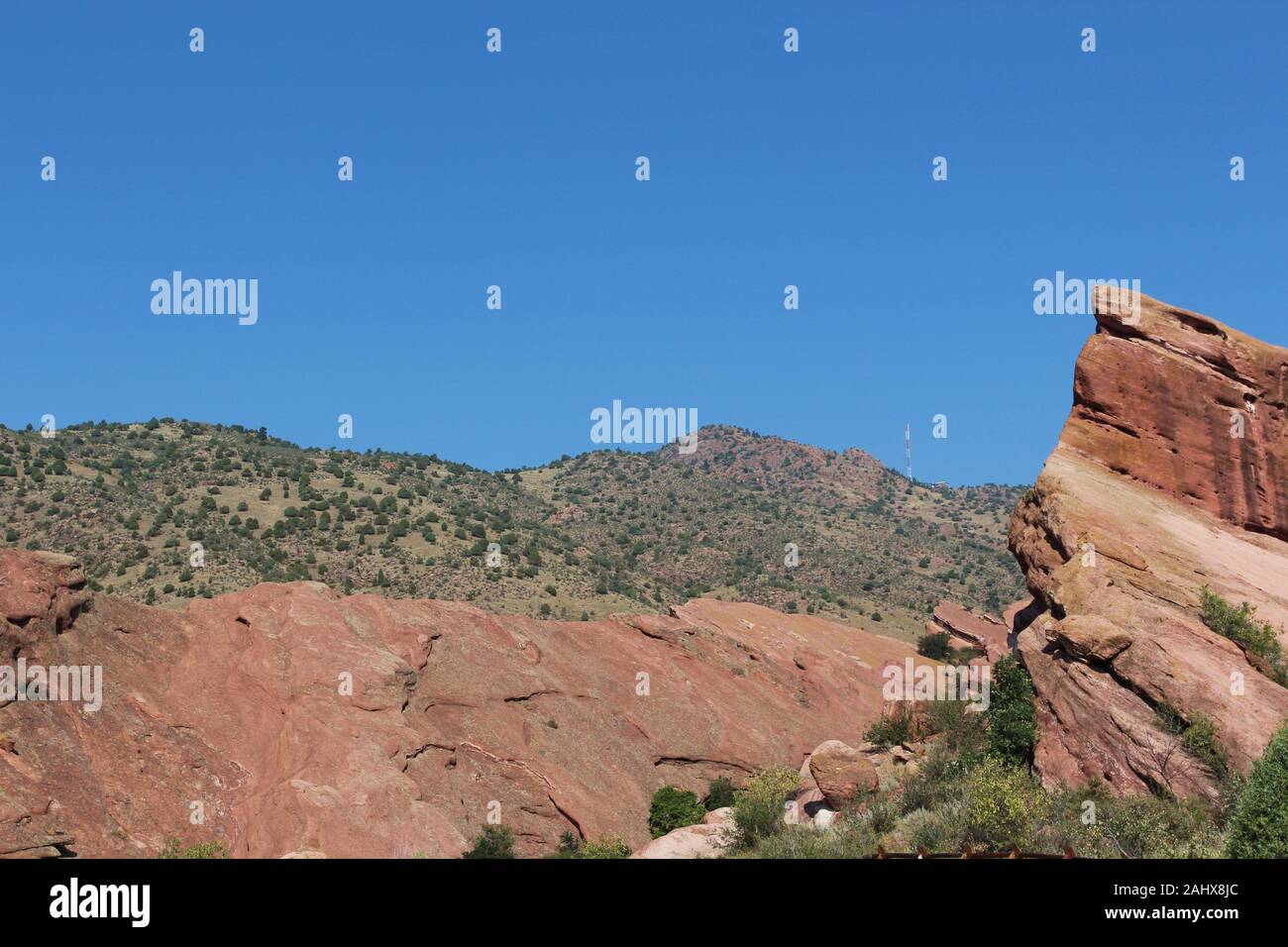Red rock formations in front of a mountainside on the Trading Post ...
