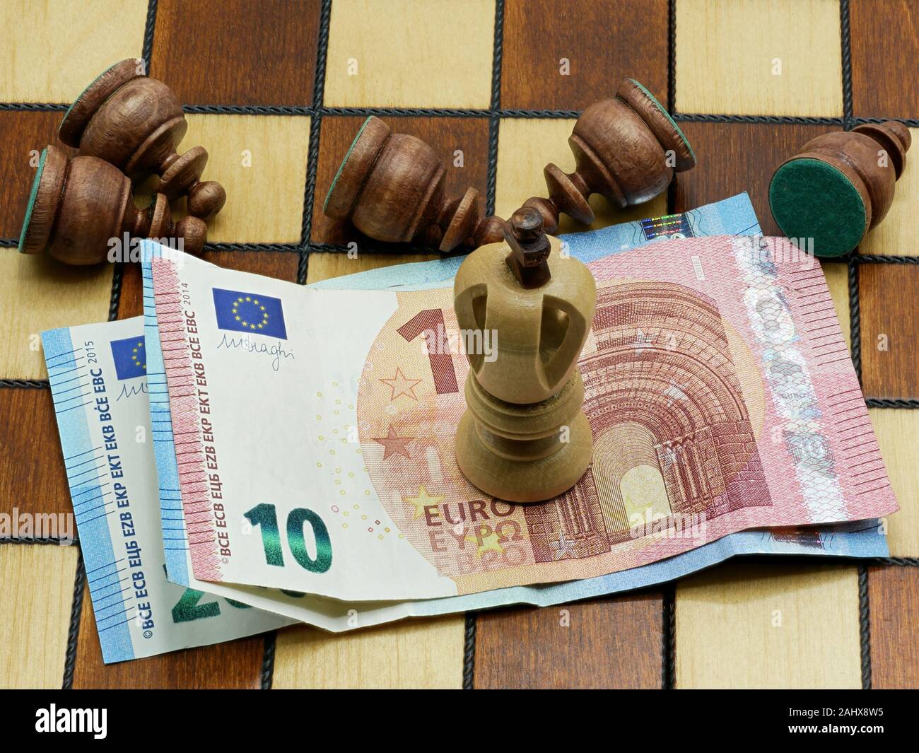 Money Rules Concept: King Chess Piece Standing On Euro Banknotes With ...