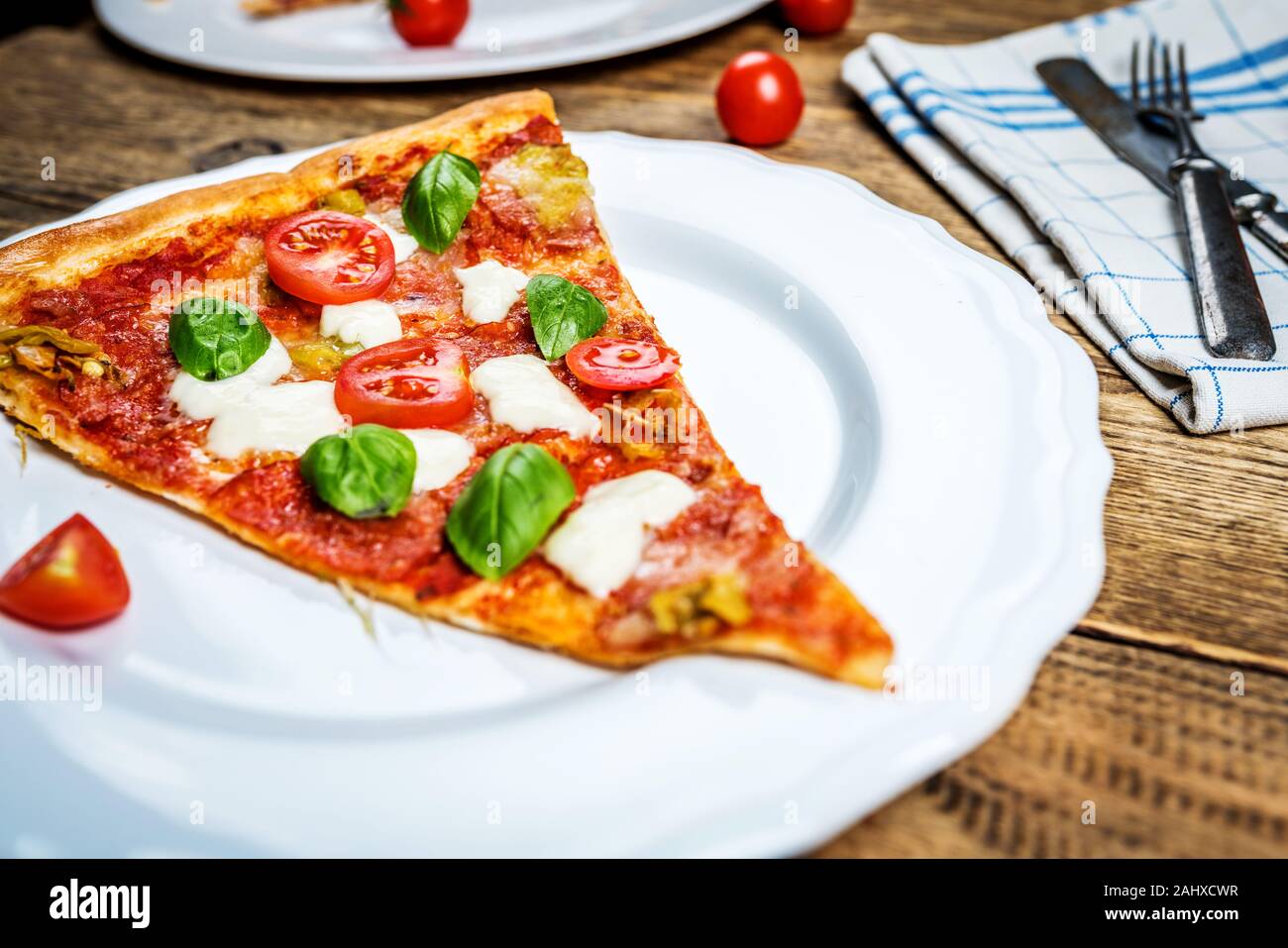 Traditional italian food pizza with mozzarella, tomato and salami on ...