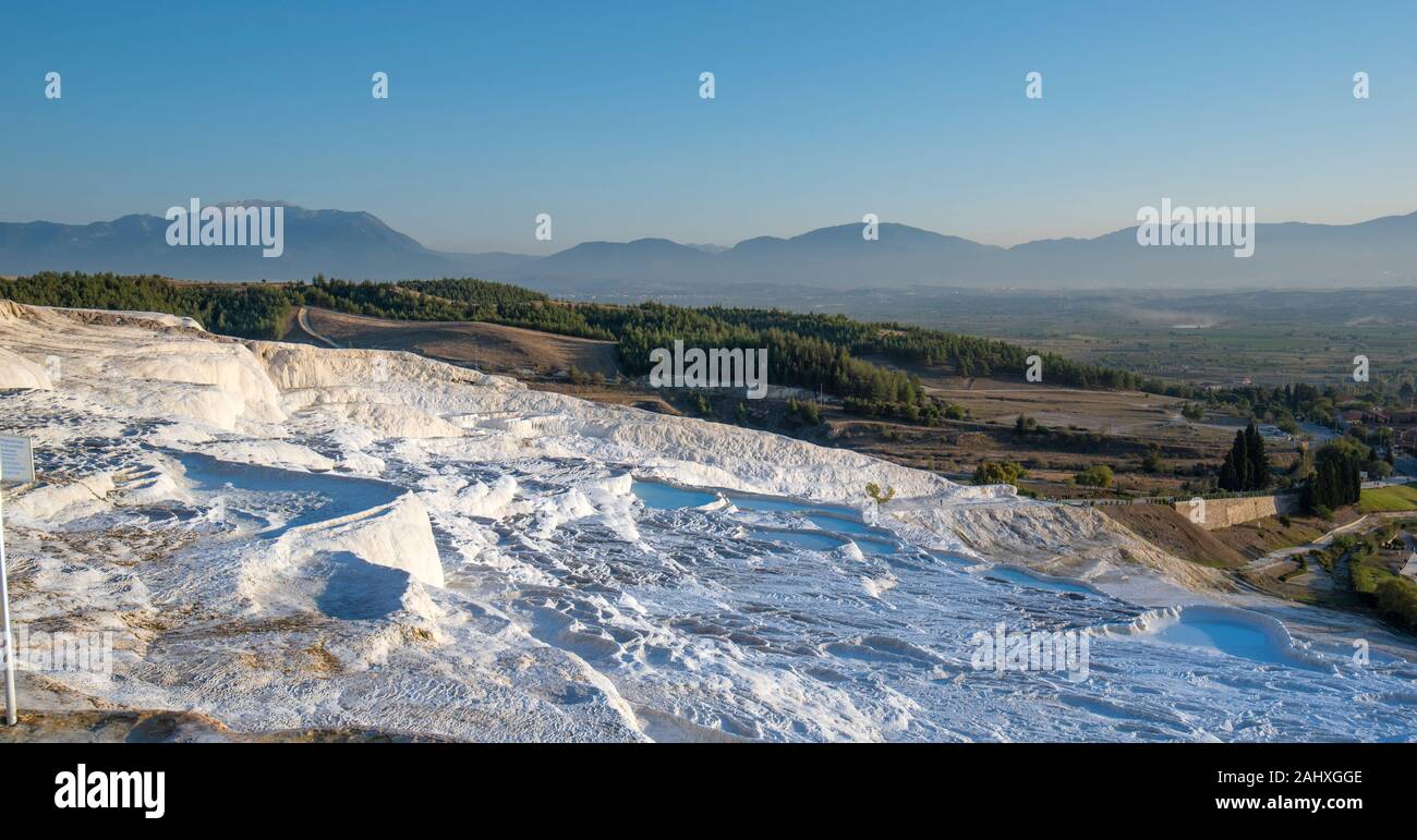 Beautiful sunset and Natural travertine pools and terraces in Pamukkale ...