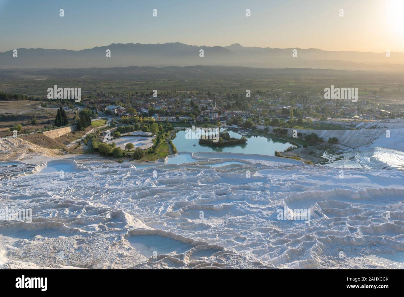 Beautiful sunset and Natural travertine pools and terraces in Pamukkale ...