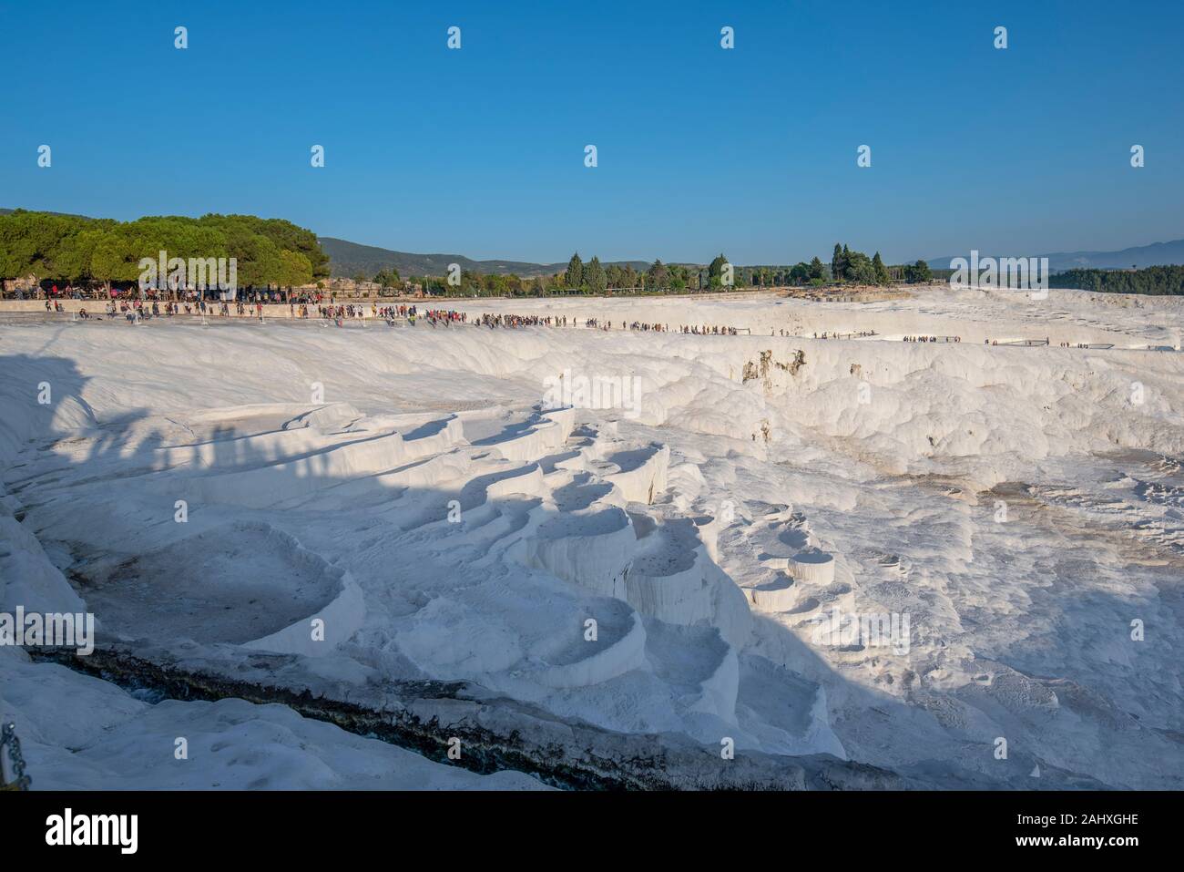 Beautiful sunset and Natural travertine pools and terraces in Pamukkale ...