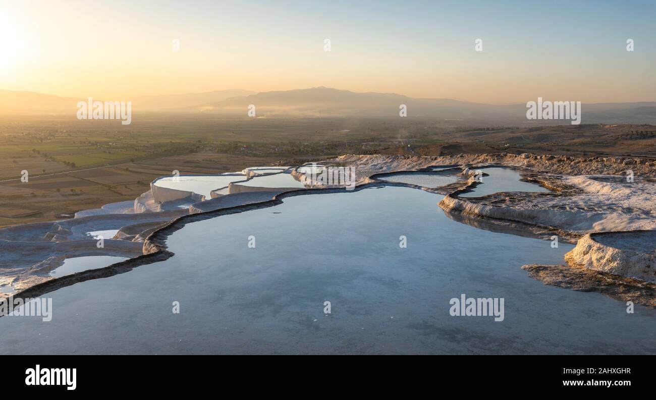 Beautiful sunset and Natural travertine pools and terraces in Pamukkale ...