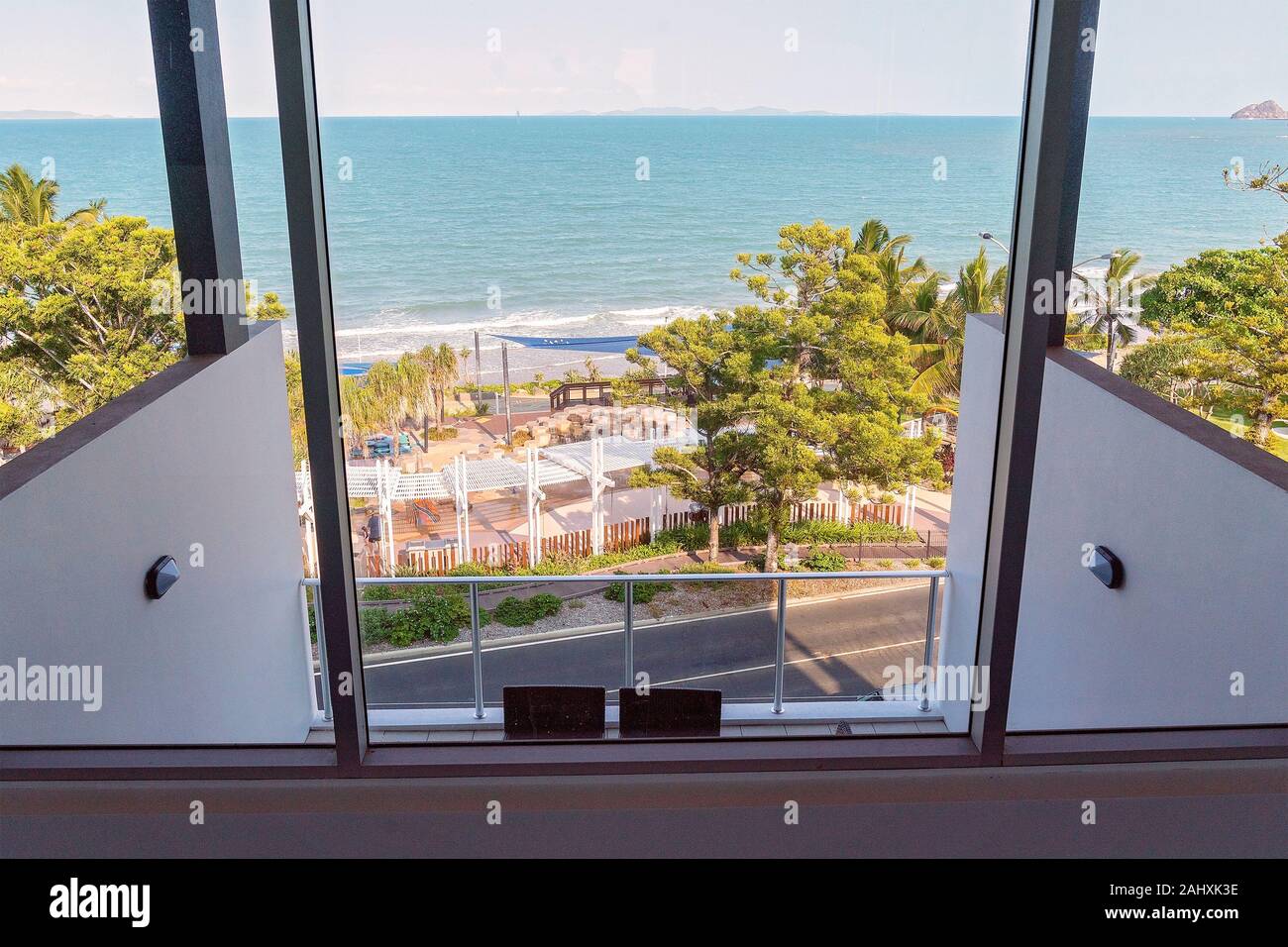 View from a holiday apartment balcony down to the road in front and a ...