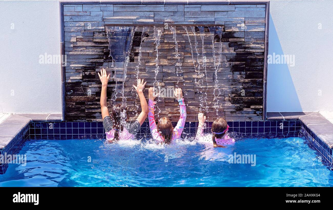 Girl playing in waterfall hi-res stock photography and images - Alamy