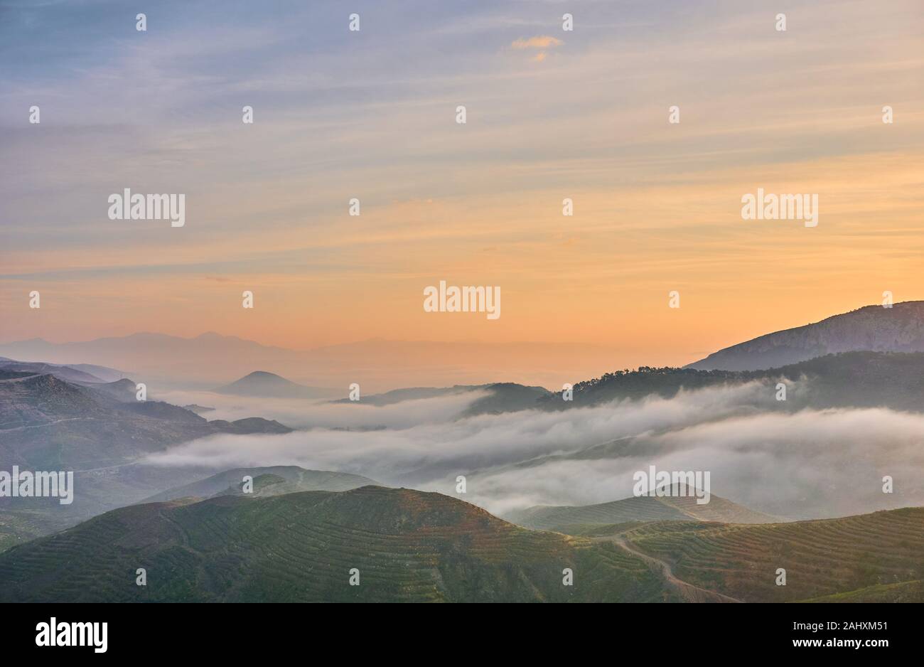 Beautiful Sunrise over Clouds and Mountains Stock Photo - Alamy