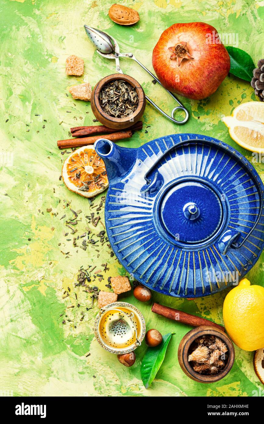 Natural ingredients for tea.Porcelain blue teakettle.Useful tea with ...