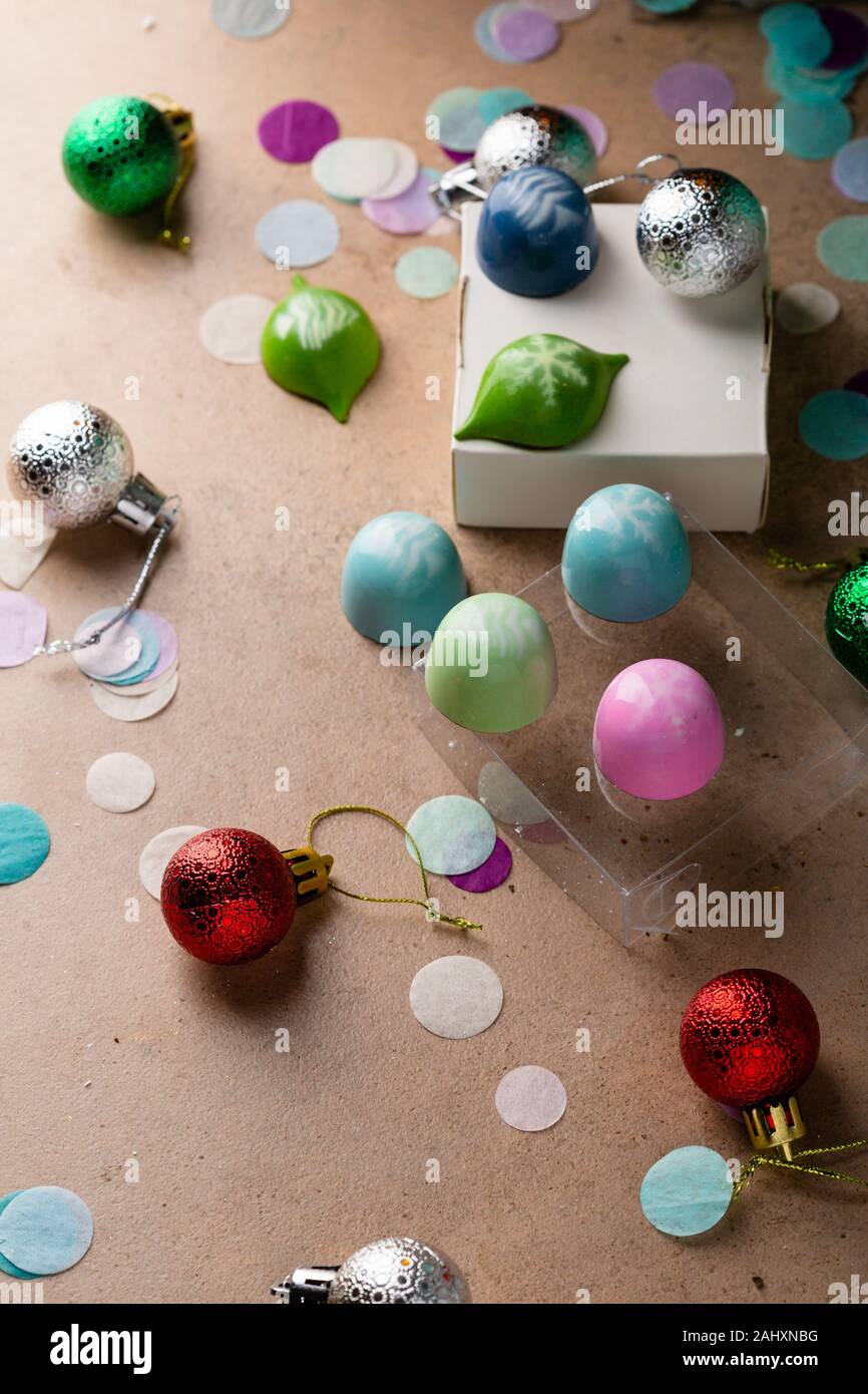 Chocolate candy and small christmas decorations Stock Photo - Alamy