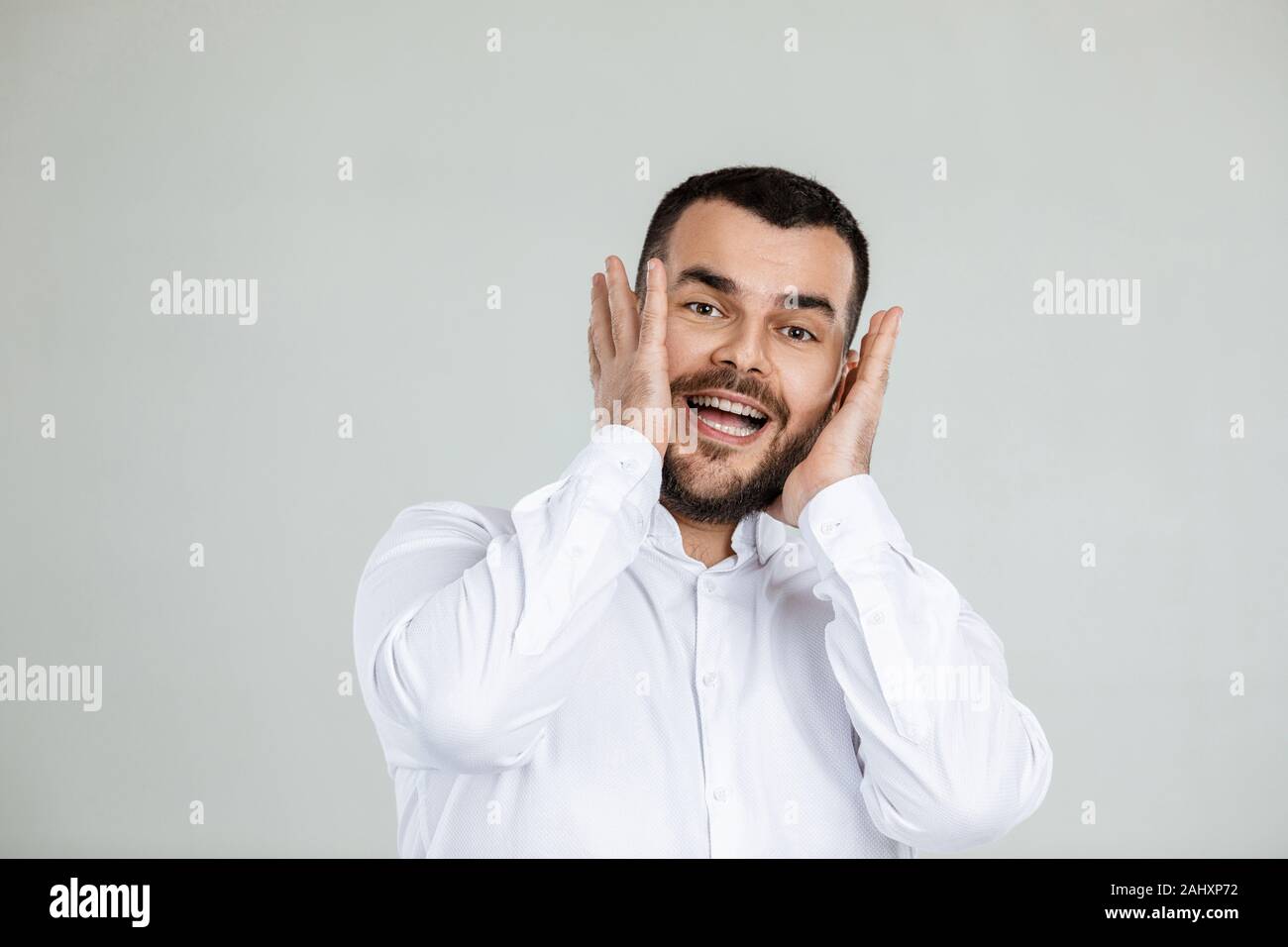 Portrait Of Young Surprised Handsome Bearded Man With Shocked Facial