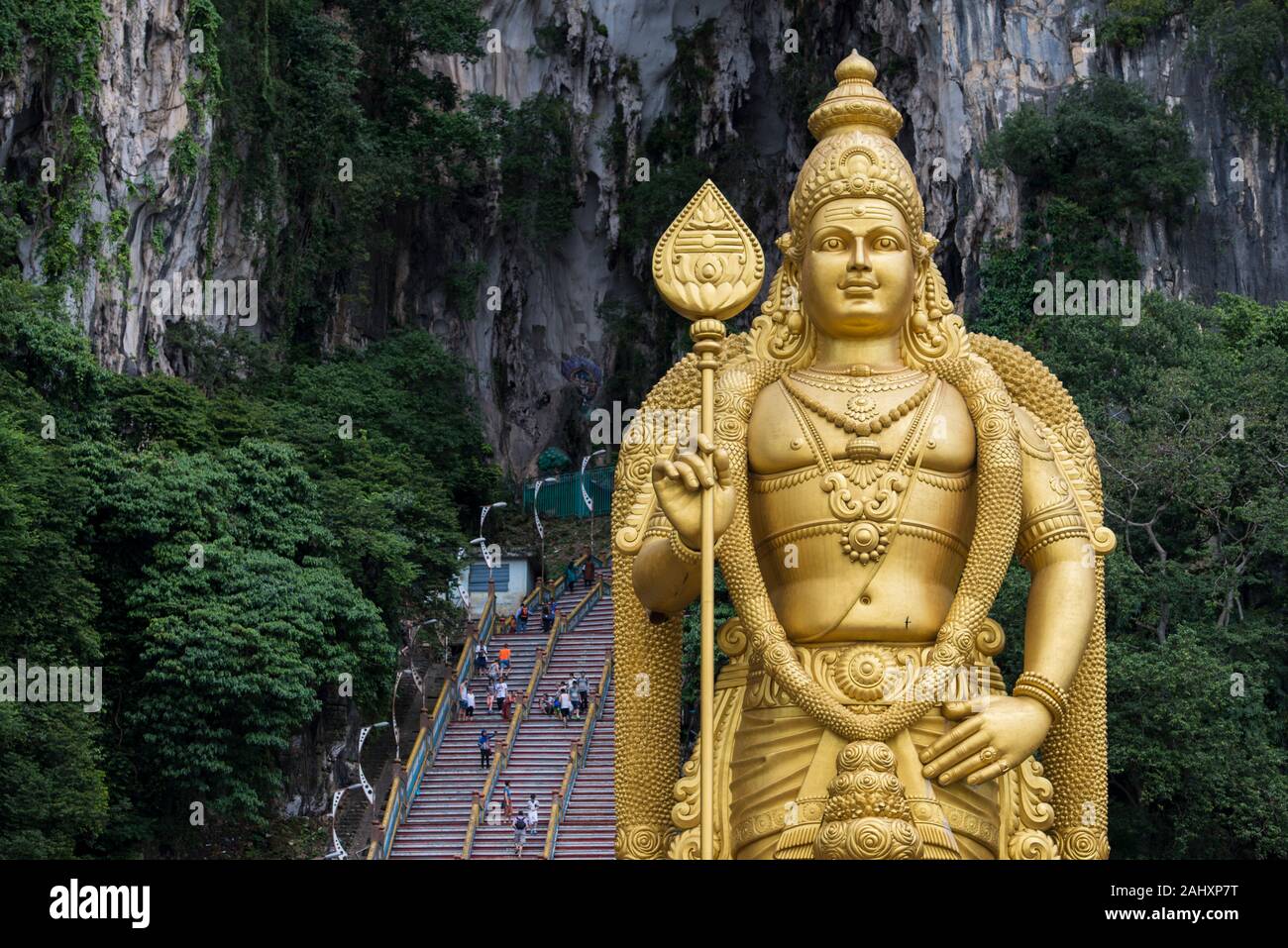 The Batu Caves are located within a high limestone outcropping. A ...